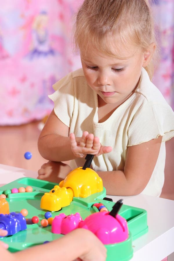 Girl playing a board game stock photo. Image of girl - 20732126