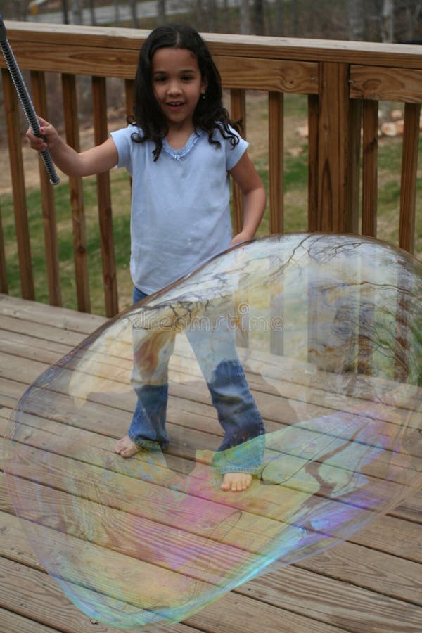 Girl Playing with Bubbles stock image. Image of excited - 603717