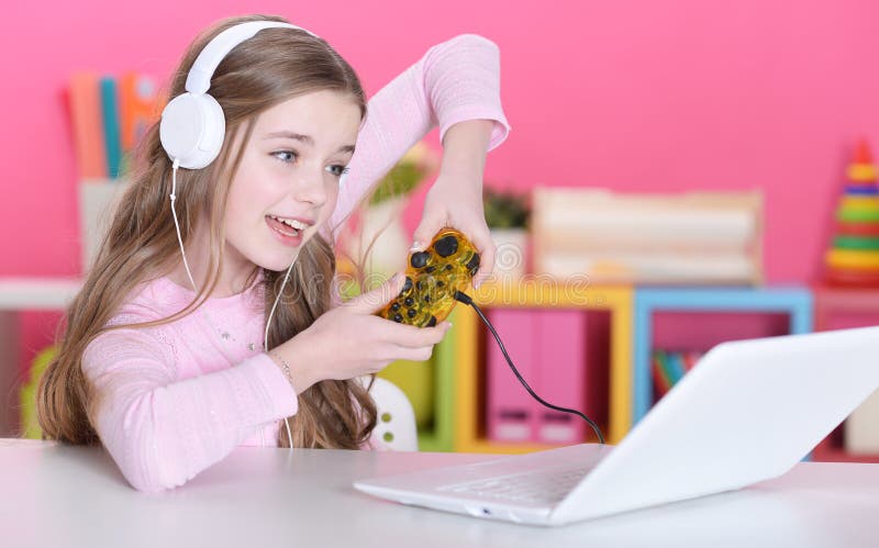 Girl Playing a Computer Game Stock Photo - Image of notebook ...