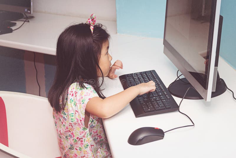 Girl Playing with a Computer Stock Image - Image of communication, boys ...