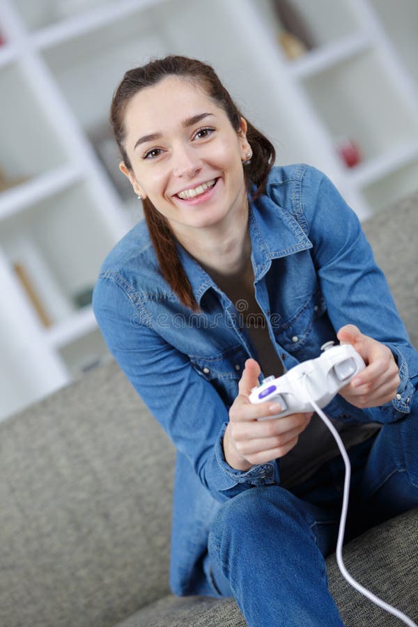 Girl playing on console stock image. Image of activity - 102274419