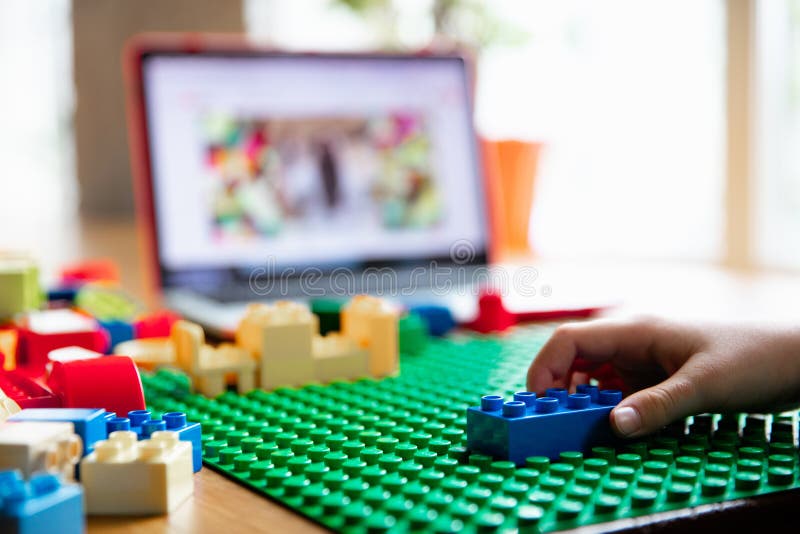 Girl Playing with Constructor at Home, Watching Teacher`s Tutorial on ...
