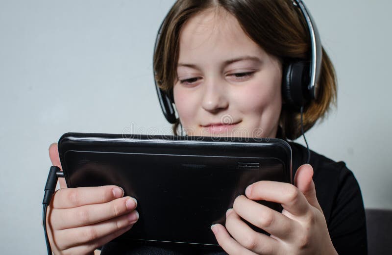 Girl Child with a Handheld Computer. Stock Photo - Image of gaming ...