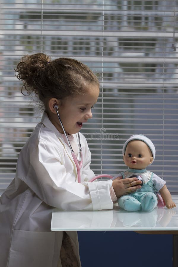 Girl playing doctor stock image. Image of pediatrician - 50700405