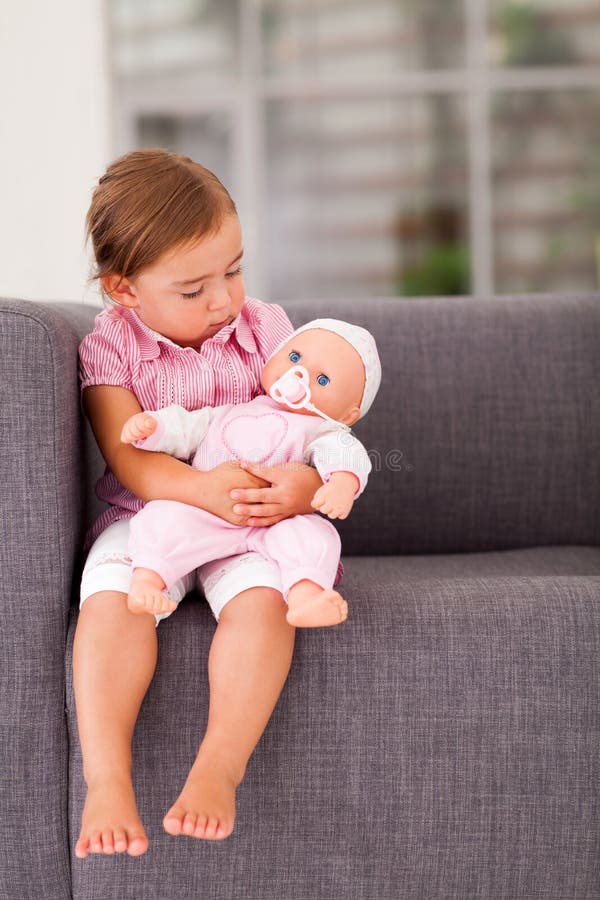 Girl playing doll stock image. Image of innocent, child - 28523187
