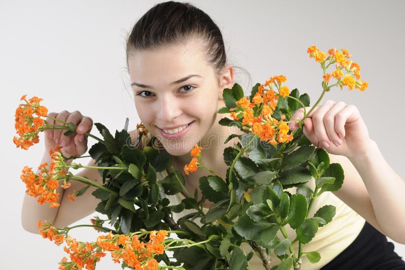 Girl playing with flowers stock photo. Image of women - 18097572