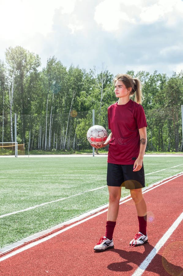Girl playing football stock image. Image of stadium, liverpool - 84035979