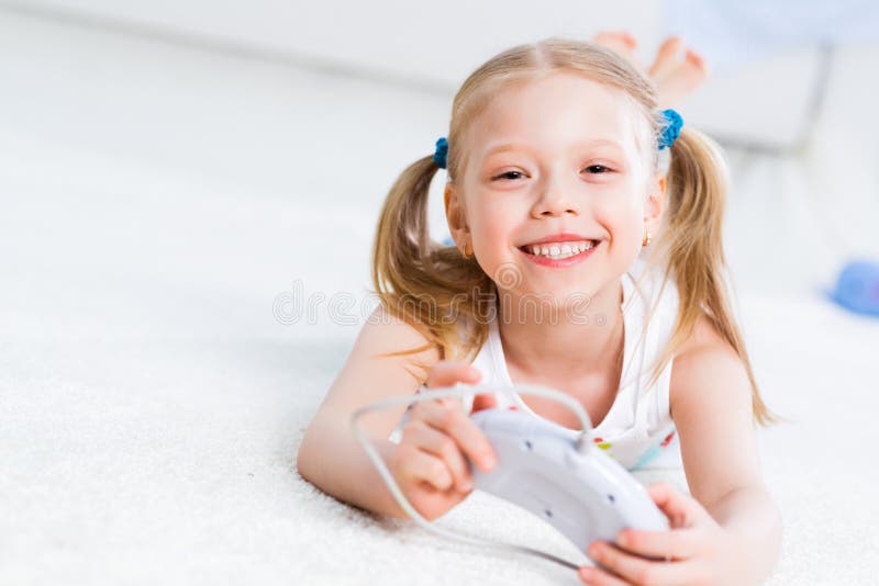 Girl Playing on a Game Console Stock Photo - Image of caucasian, home ...
