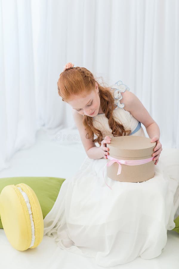 Girl playing with gift box stock photo. Image of girl - 71545804