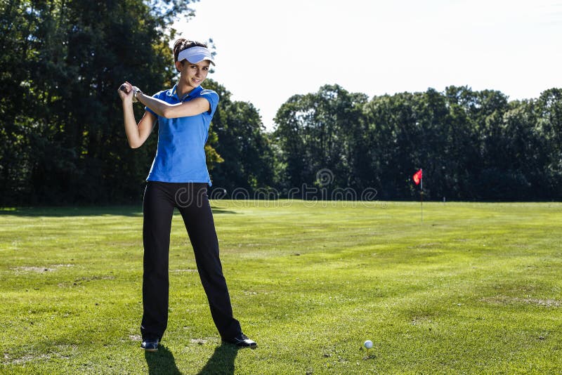Woman Playing Golf on a Green Woman Stock Photo - Image of club, golf ...