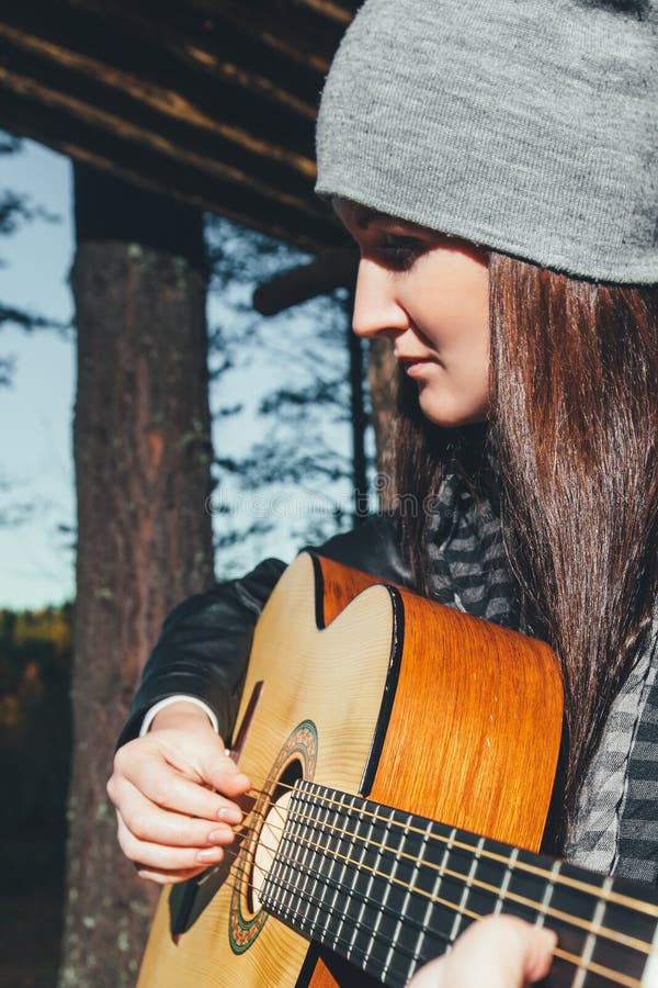 Girl Playing the Guitar stock photo. Image of bard, activity - 87597498