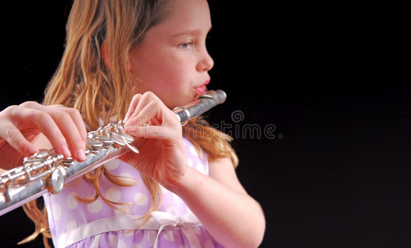 Girl Playing Instrument stock image. Image of protegee - 4656575
