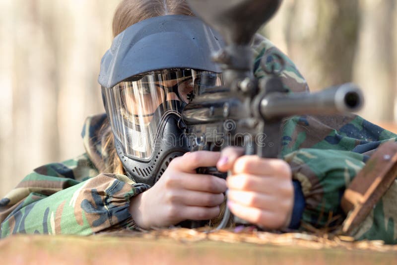 Girl Playing Paintball in Overalls with a Gun. Stock Image - Image of ...