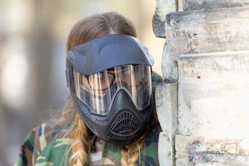 Girl Playing Paintball in Overalls with a Gun. Stock Image - Image of ...