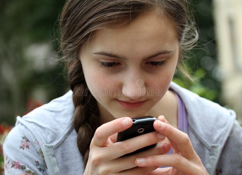 Girl playing on phone stock image. Image of adult, girl - 27671981
