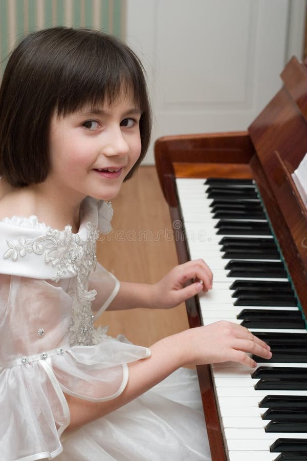 Girl playing piano stock image. Image of concert, lesson - 2301121