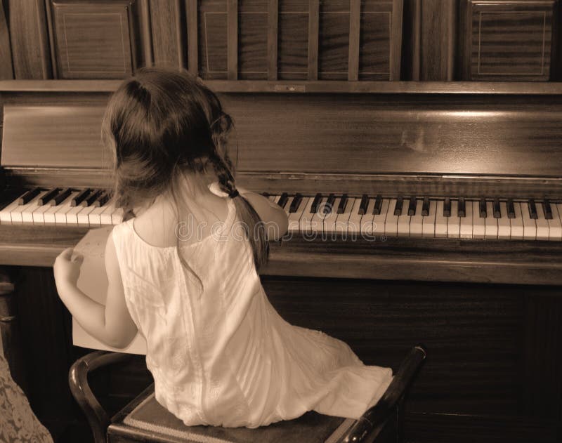 Girl playing piano stock photo. Image of seated, upright - 5452098