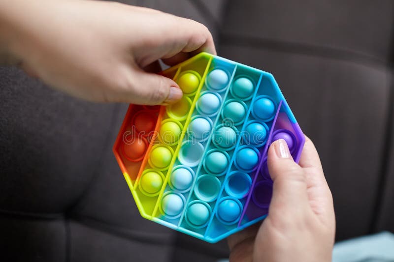 Push Pop Bubble Sensory Fidget Toy in Hands Stock Photo - Image of ...