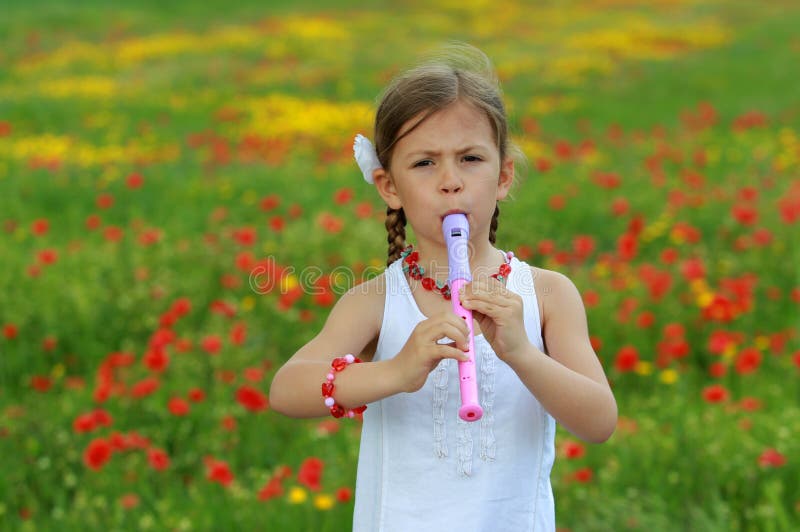 Girl playing the recorder stock image. Image of necklace - 14038035