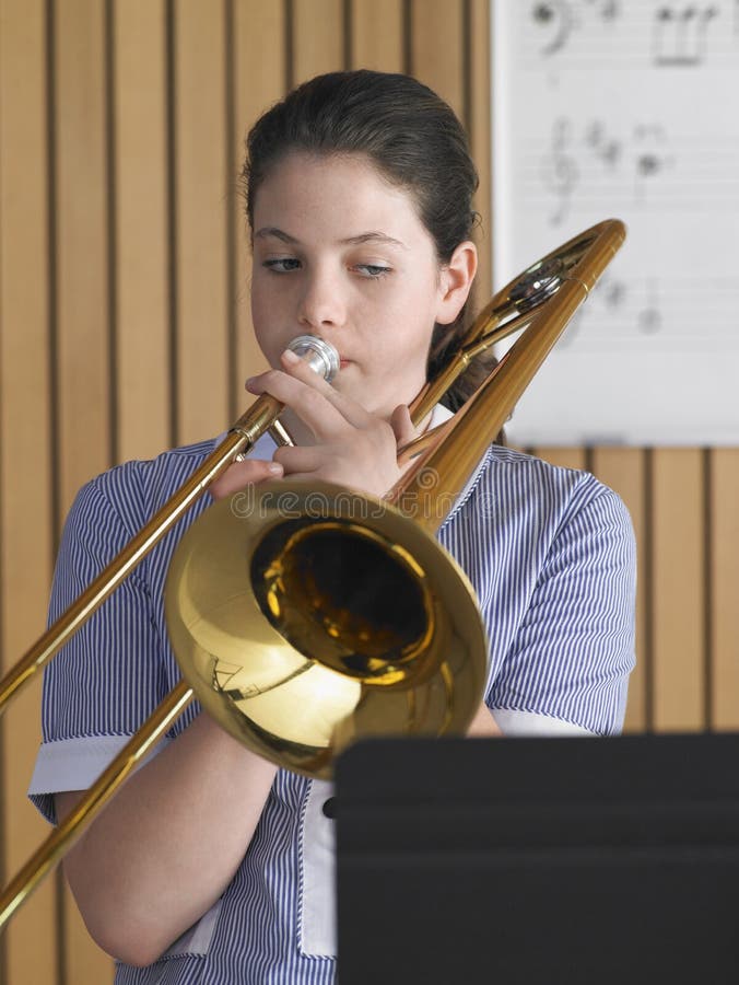 Teenage Girl Playing the Trombone Stock Photo - Image of female, girls ...
