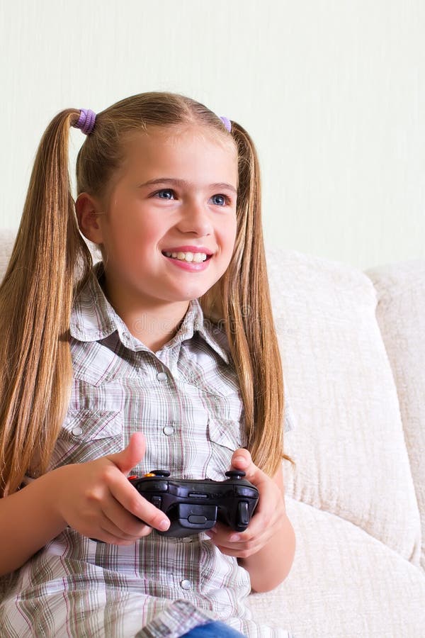 Girl playing video game. stock image. Image of beautiful - 26163225