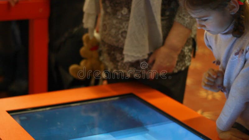 Girl Playing Video Game. Girl Kid Playing Touch Screen Game ...