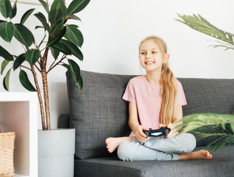 Girl Playing Video Game at Home Stock Photo - Image of female, video ...