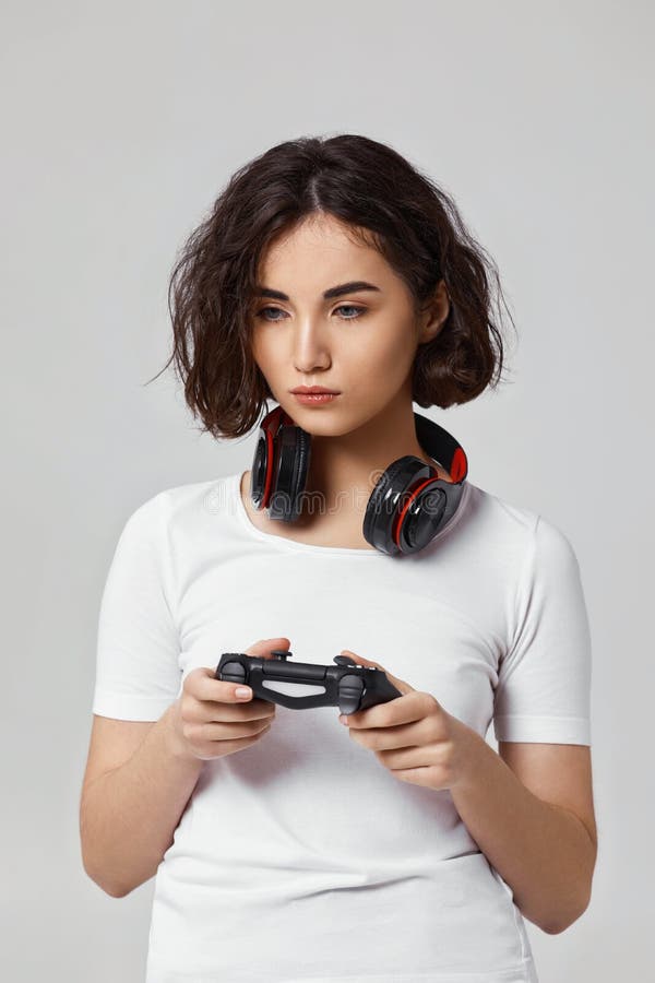 Girl Playing Video Games on Gray Background Stock Photo - Image of ...