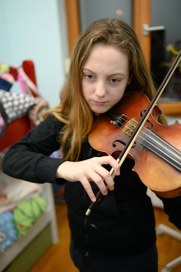 Girl playing violin stock photo. Image of practice, education - 245830806