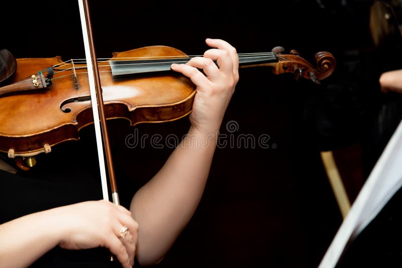 Girl Playing the Violin. Hand of a Girl and a Fiddle Stock Image ...