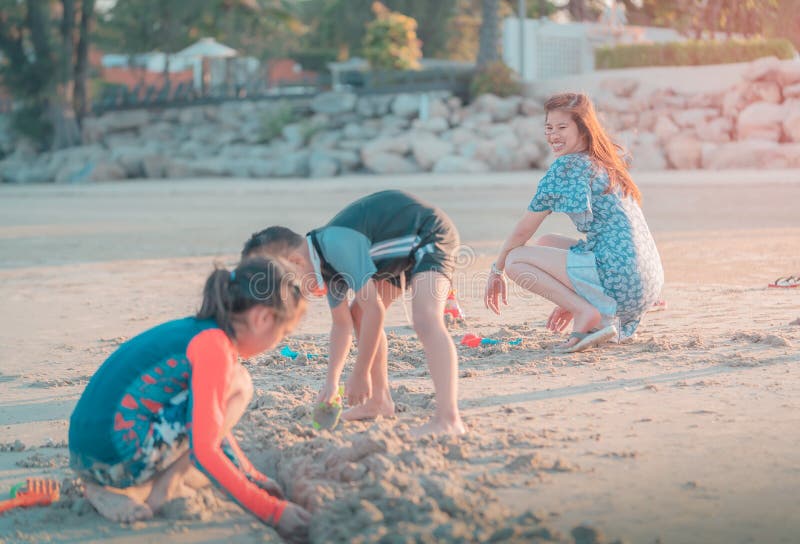 Girl Playing with Wave and Sand on the Beach Stock Image - Image of ...