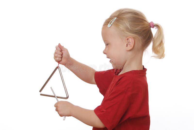 Girl plays triangle stock image. Image of noise, percussion - 42679675