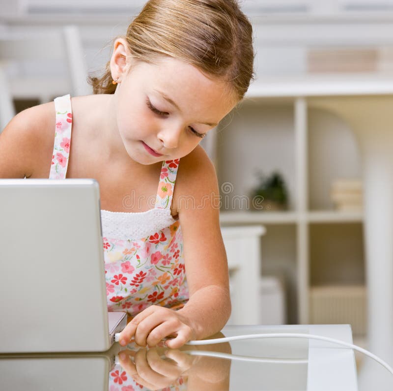 Girl Plugging Internet Cable into Laptop Stock Image - Image of ...