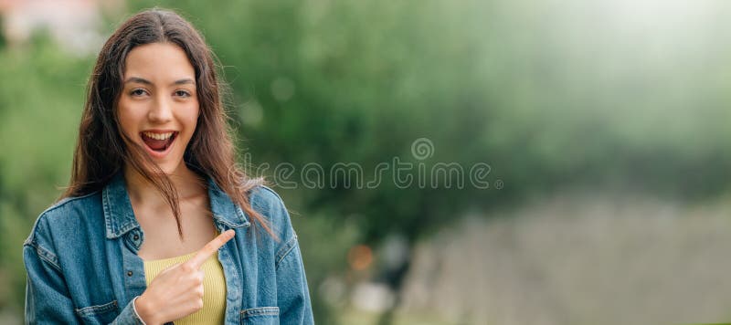 Girl Pointing Smiling Outdoors Stock Photo - Image of occasion, laugh ...
