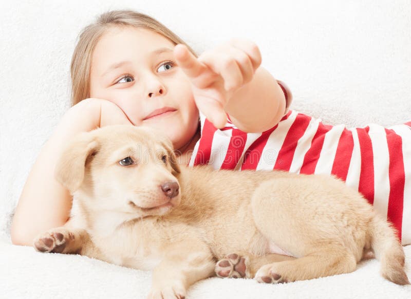 Girl points the finger pup stock photo. Image of mammal - 35221018