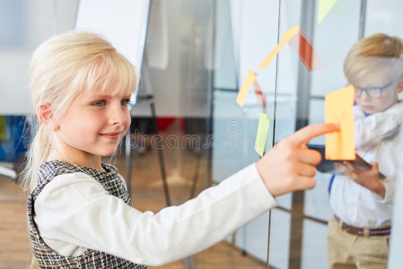 Girl Points Her Finger at a Note Stock Photo - Image of girl, people ...