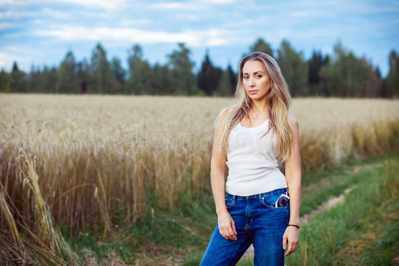 Girl Posing in a Field at Sunset Stock Photo - Image of person ...