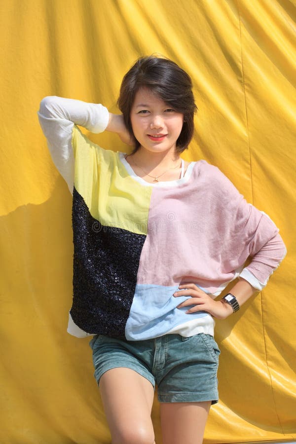 Girl post for photograph stock photo. Image of asian - 22357892