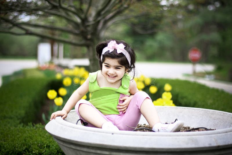 Girl in a pot stock photo. Image of baby, flora, happy - 5076682