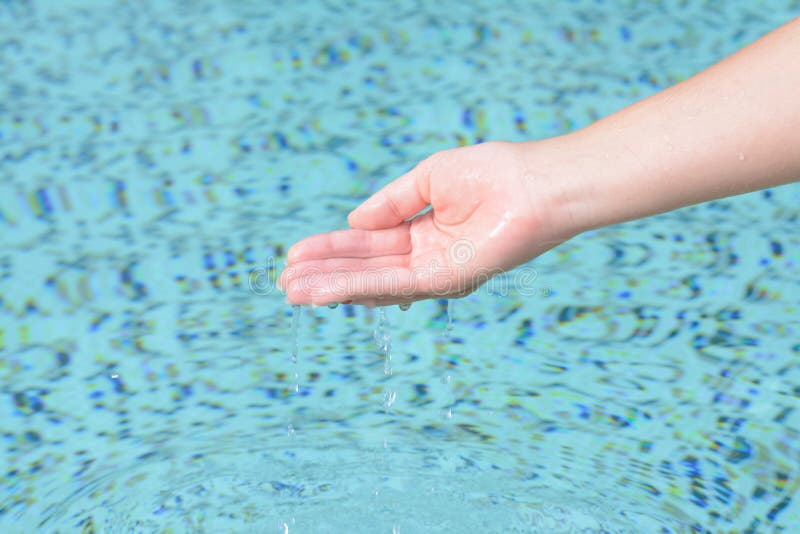 Girl Pouring Water from Hand in Pool, Closeup Stock Photo - Image of ...