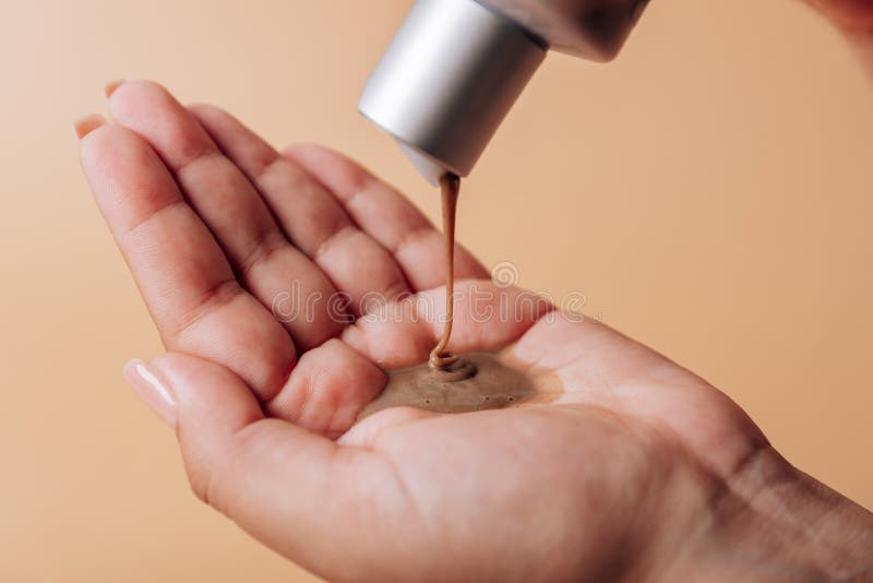 Girl Pours Chocolate Shampoo into Her Hand Stock Photo - Image of adult ...