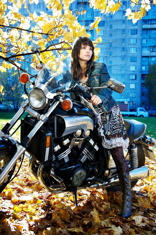 The girl and a motorcycle stock image. Image of street - 12085535