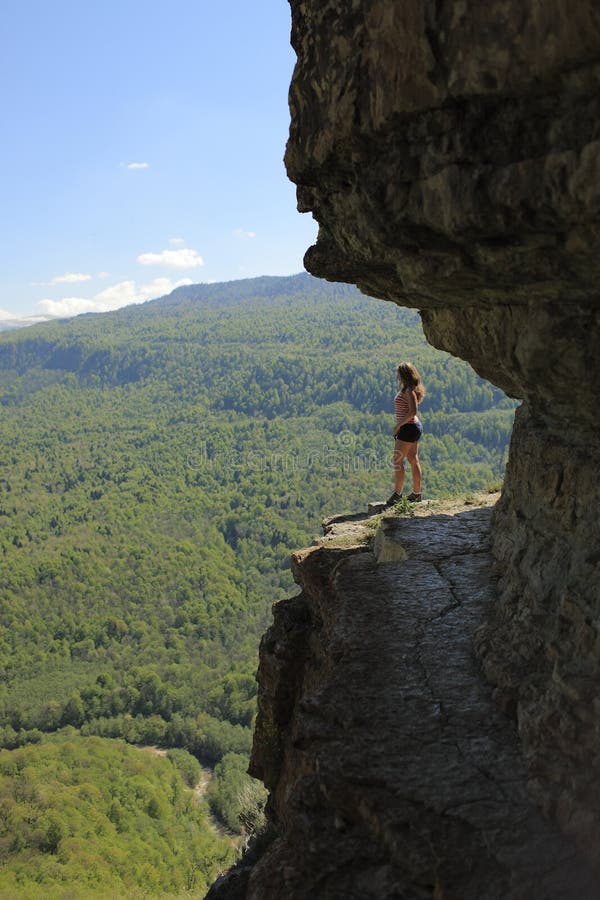 Girl on a precipice stock photo. Image of guamka, view - 26479570