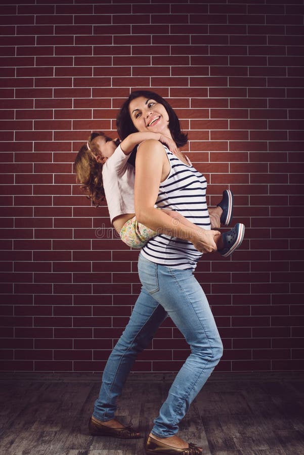 Girl on Pregnant Mother S Back Stock Photo - Image of baby, family ...