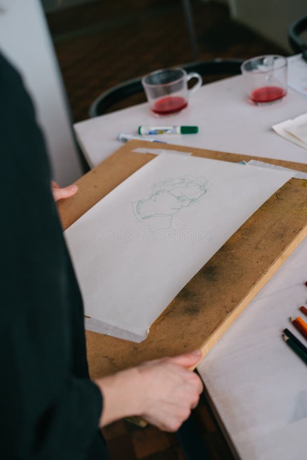 The Girl is in the Process of Drawing. Sketching with a Colored Pencil ...