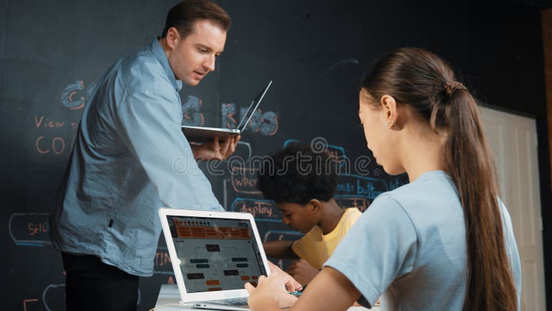 Girl Programing or Coding System while African Boy Fixing Model ...