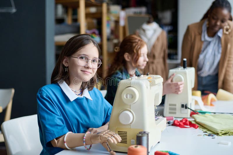Girl with Prosthetic Hand with Sewing Machine Stock Image - Image of ...