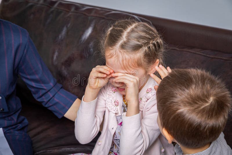 Girl Psychologist Calms Upset Girl. the Kid is Crying. Stock Photo ...