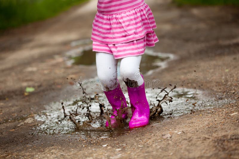 Child Jumping in Mud Puddle Stock Image - Image of environment, healthy ...