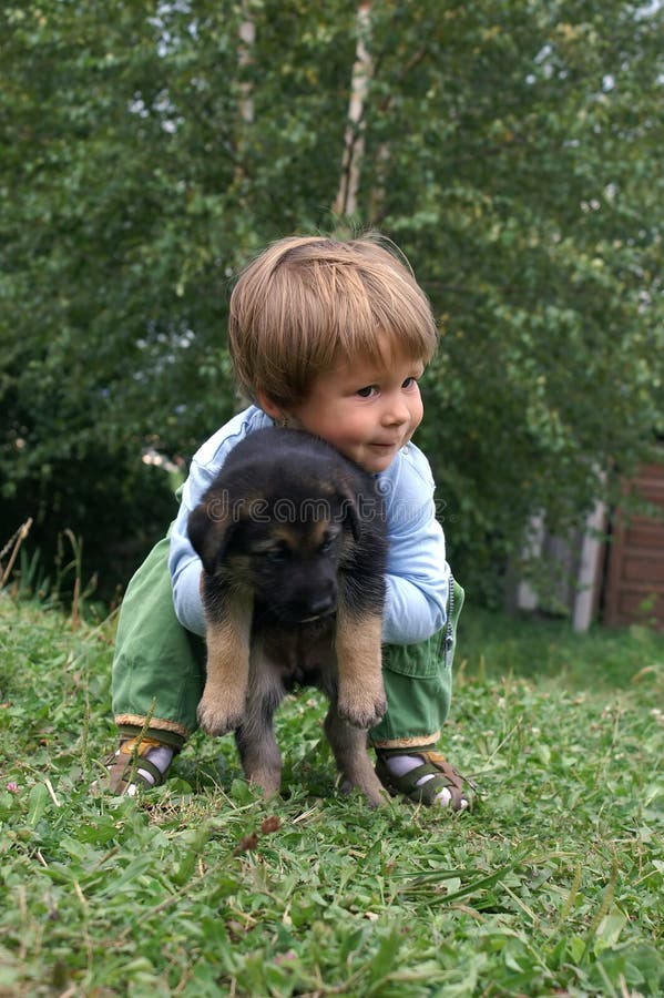 Girl with puppy stock photo. Image of child, playing, innocent - 1277968